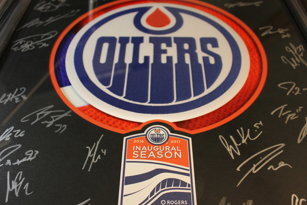 Framed Autographed Edmonton Oilers Crest - NHL Auctions