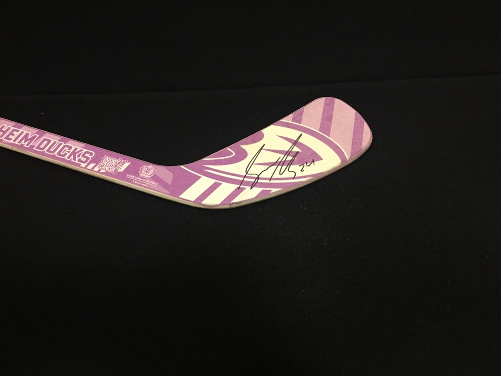 #24 Simon Despres Autographed Lavender Mini Stick - NHL Auctions